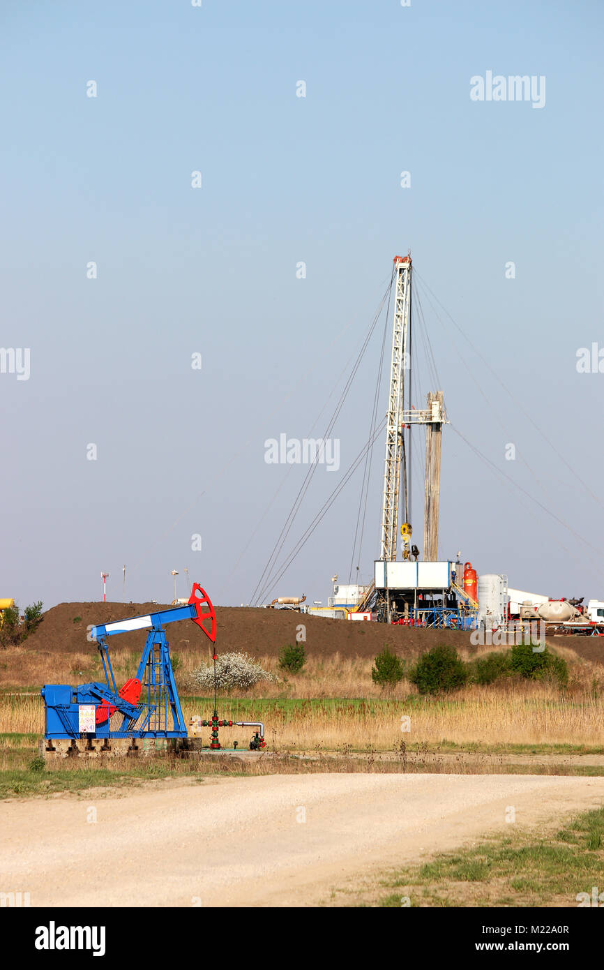 pump jack and oil drilling rig in the oilfield Stock Photo - Alamy