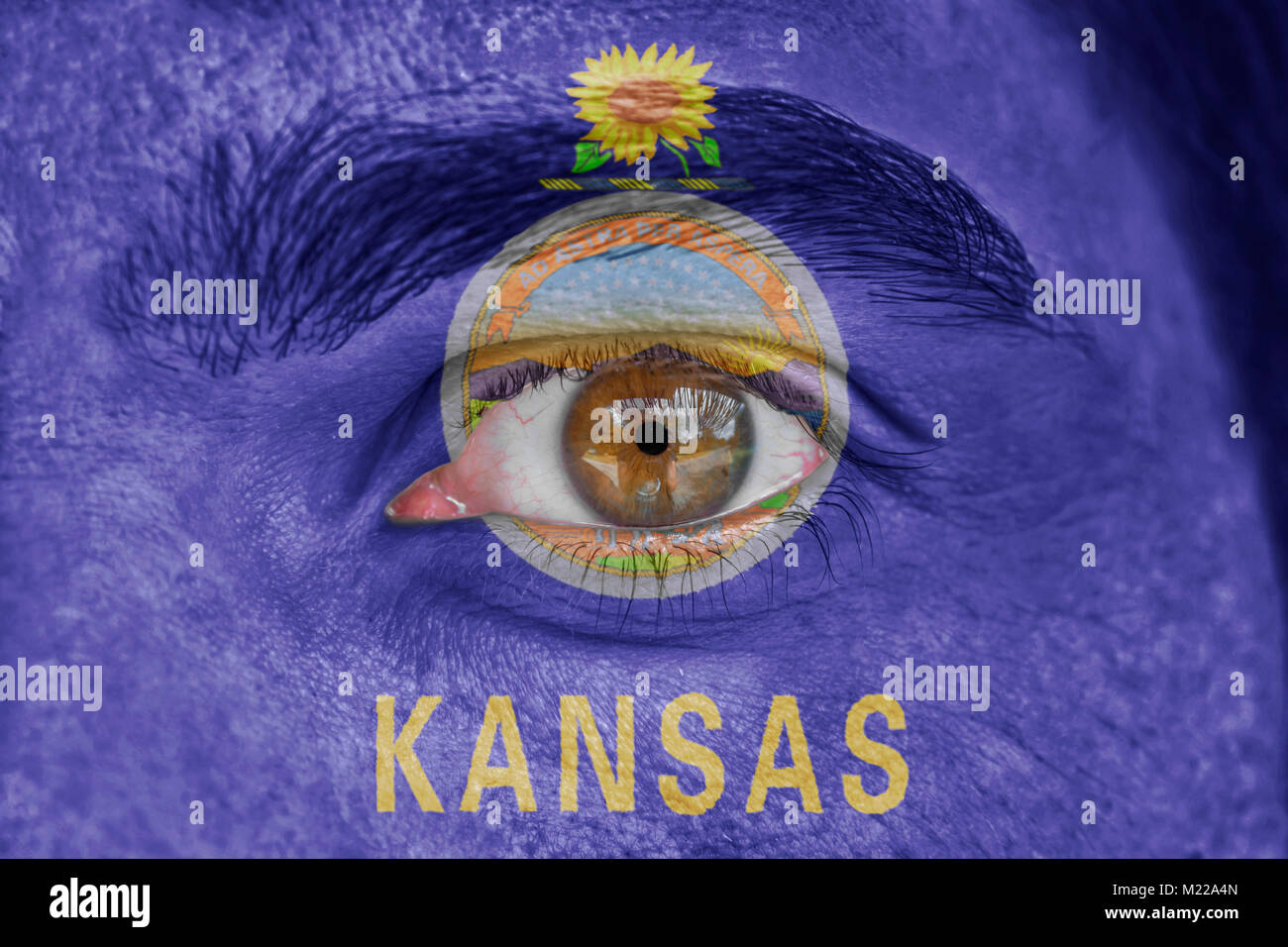 Human face and eye painted with US state flag of Kansas Stock Photo - Alamy