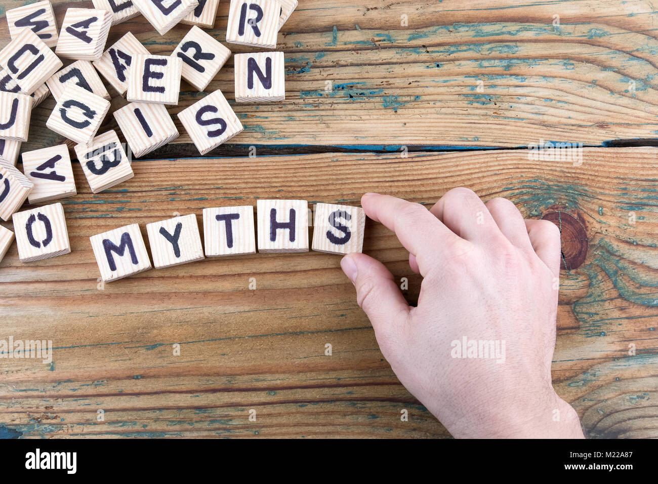 myths. Wooden letters on the office desk, informative and communication ...