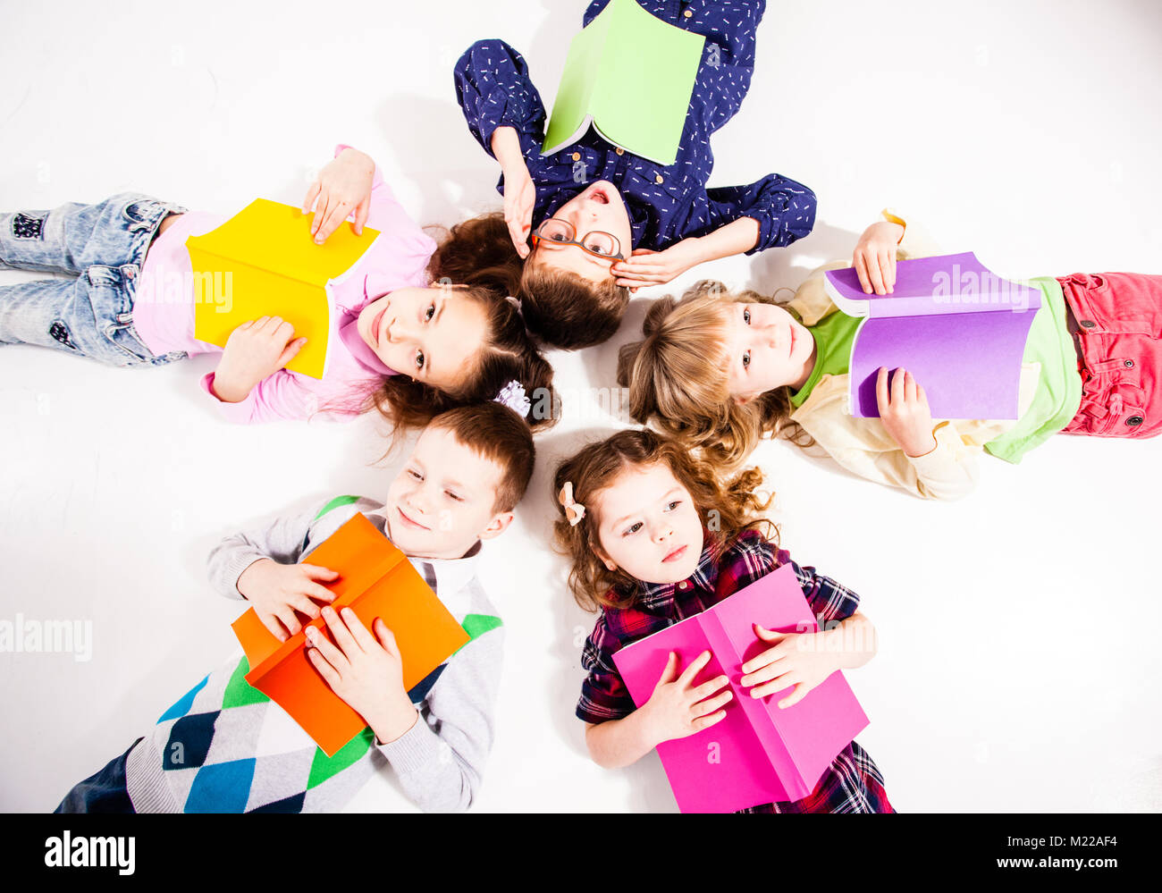 The cute children with books Stock Photo - Alamy