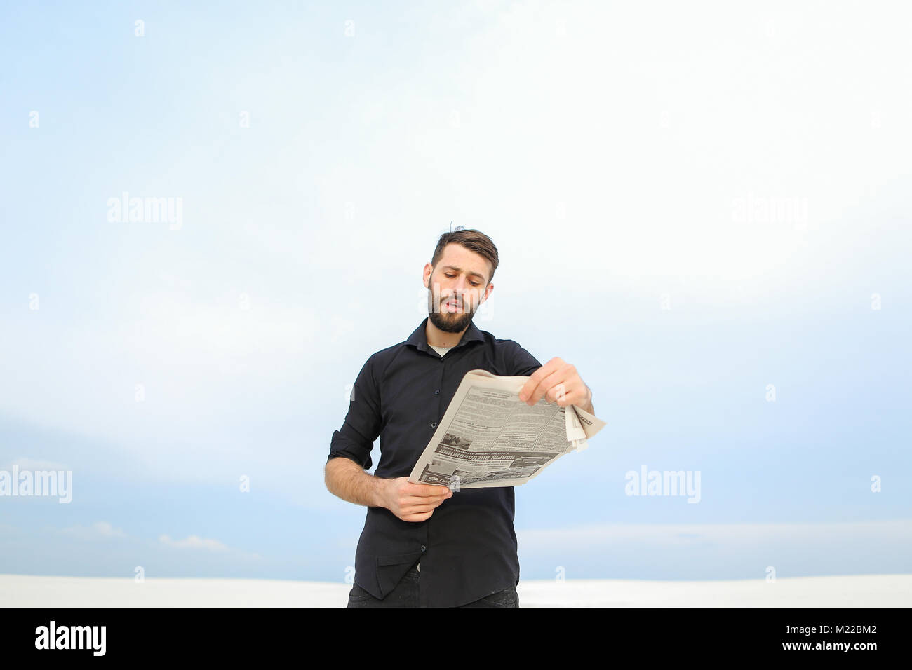 doctor reading newspaper in countryside Stock Photo - Alamy