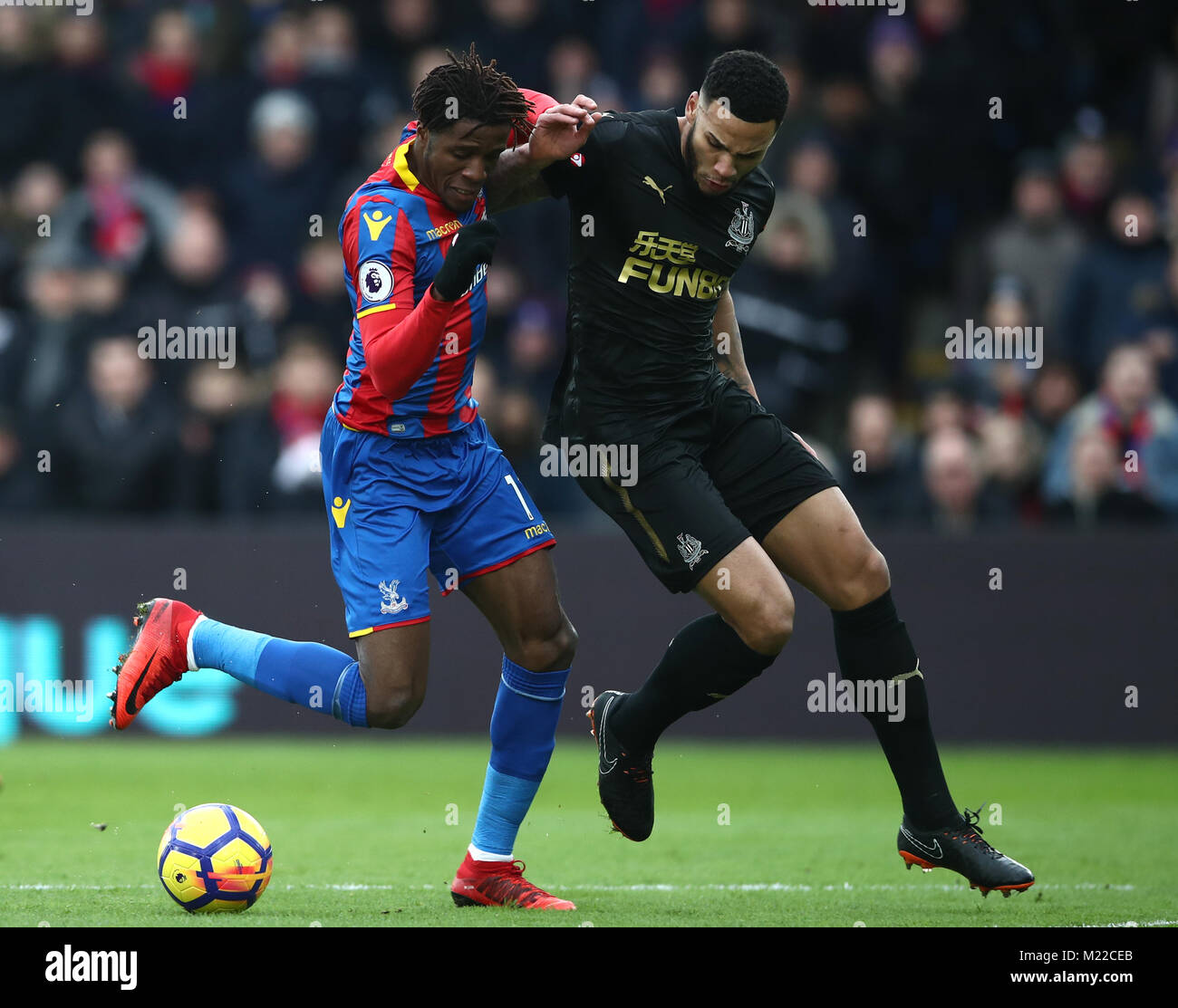 Crystal Palace's Wilfried Zaha (left) and Newcastle United's Jamaal ...