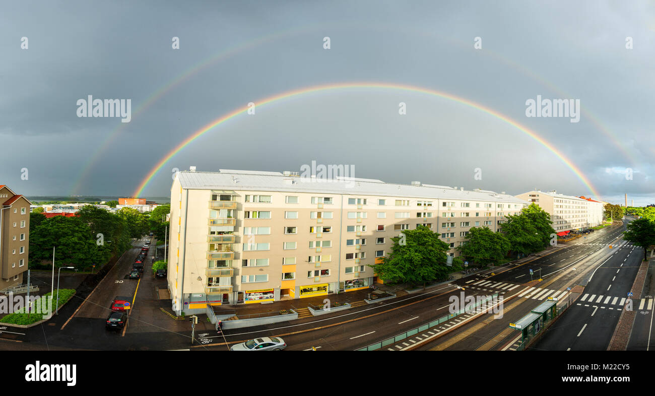 Rainbow over an apartment building in a city Stock Photo - Alamy