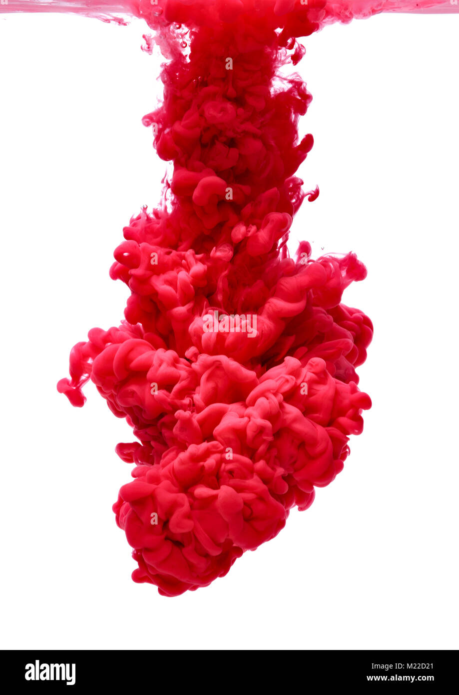 red color paint pouring in water Stock Photo - Alamy