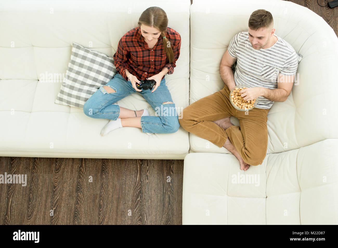 Above view portrait of young couple playing video games at home, young ...