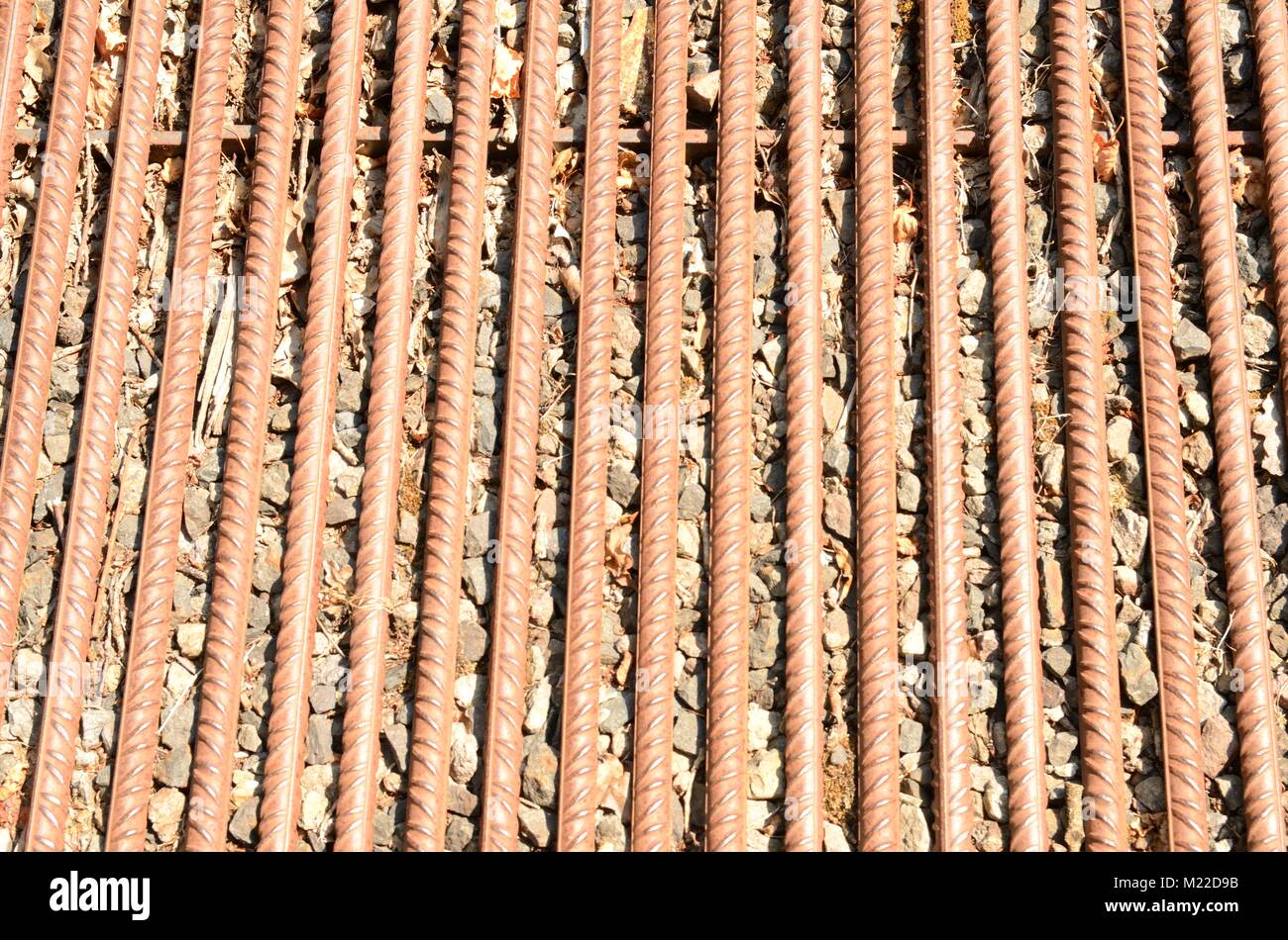 Floor of iron bars and pebbles Stock Photo - Alamy