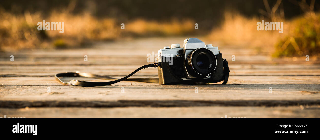 Vintage Camera on a wood path Stock Photo - Alamy