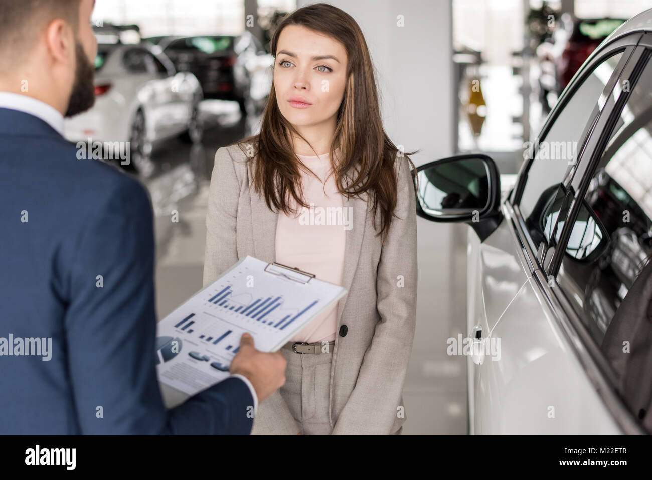 Salesperson in modern dealership hi-res stock photography and images ...