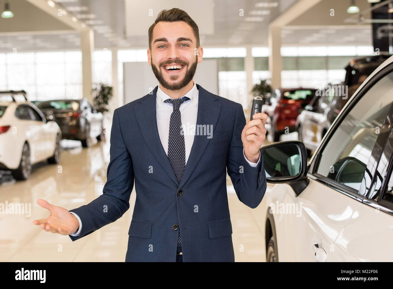 Salesman posing car showroom hi-res stock photography and images - Alamy