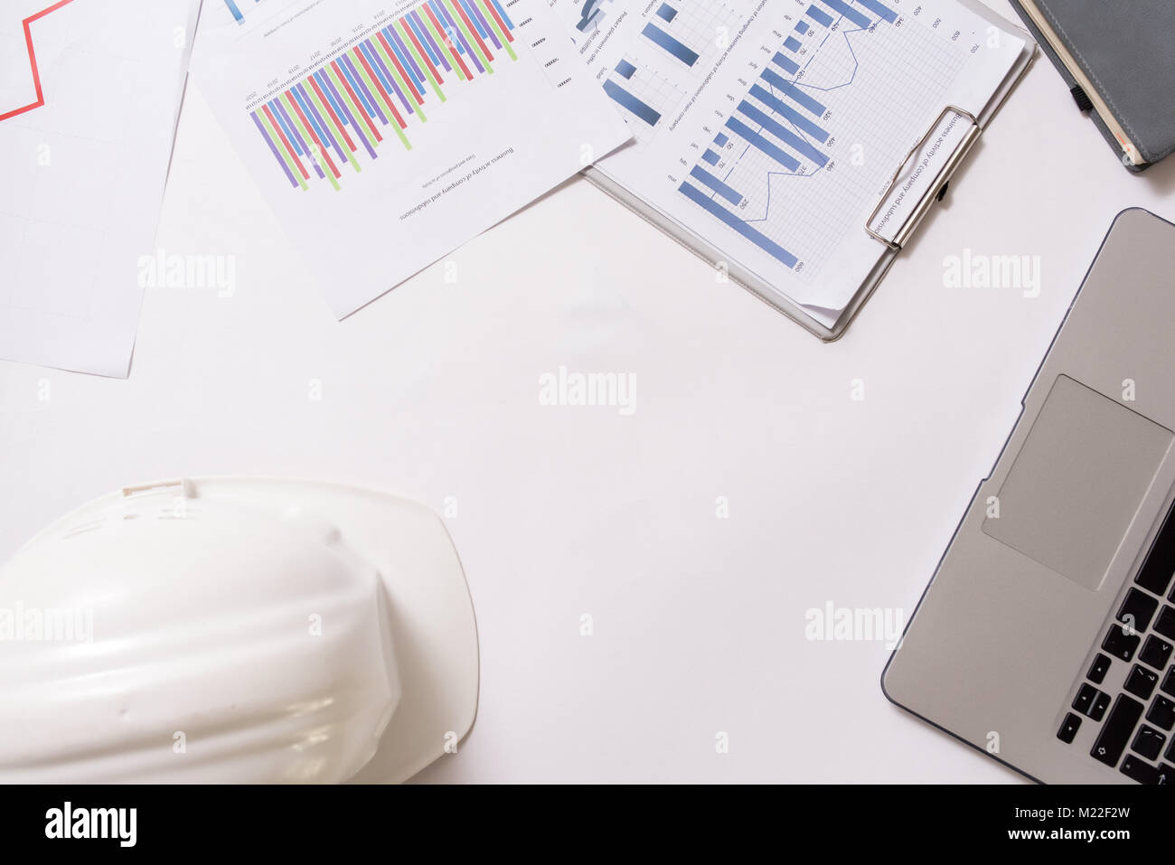 Above view background of engineering documents lying on work table next ...