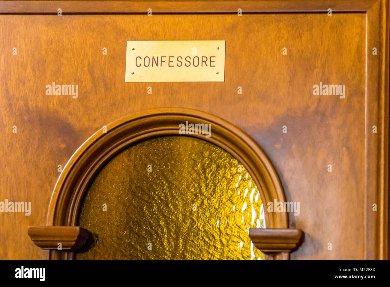 wood confessional door with Italian word meaning confessor Stock Photo ...