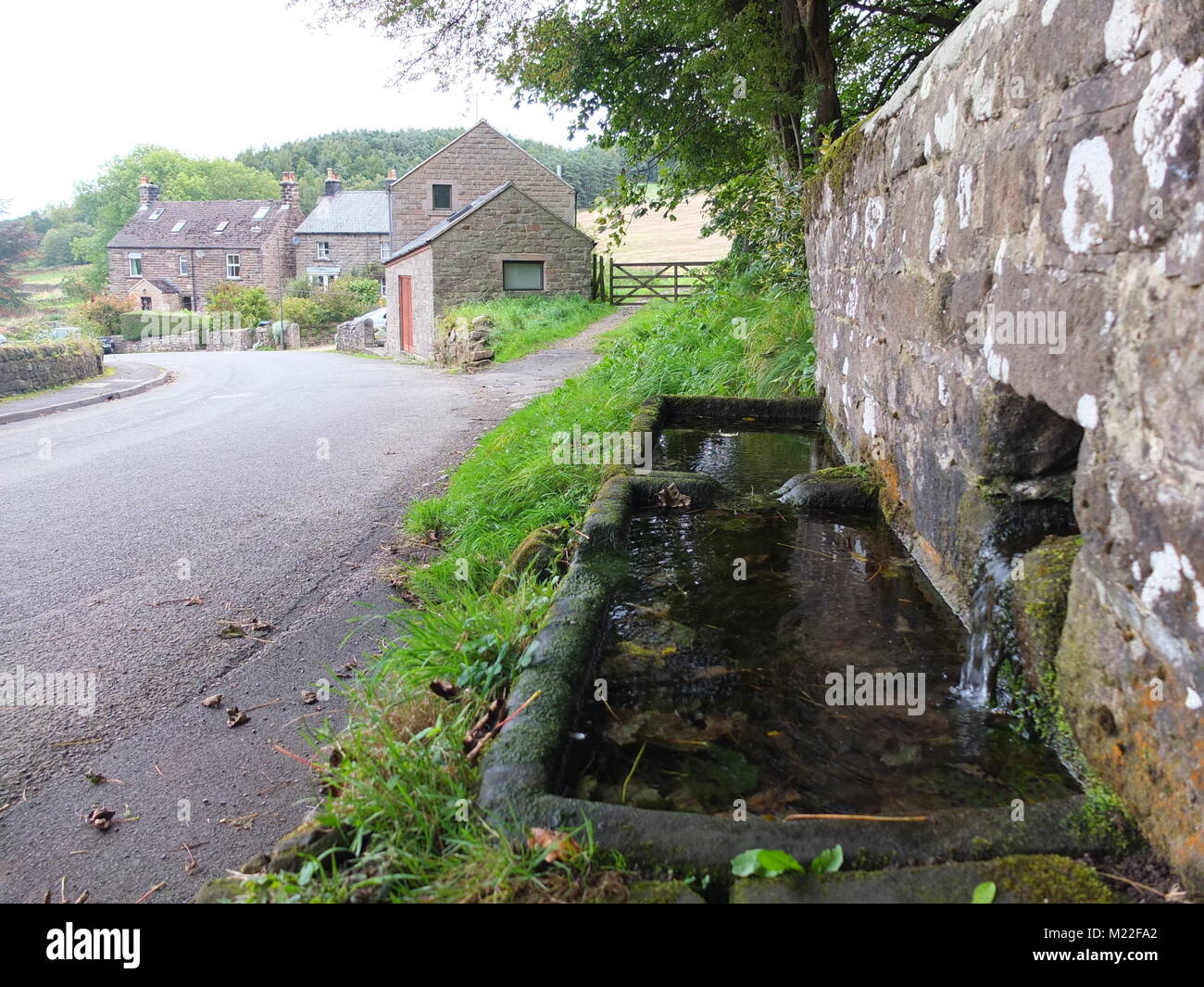 Stone water trough fed by natural spring at Birchover, nr Matlock ...