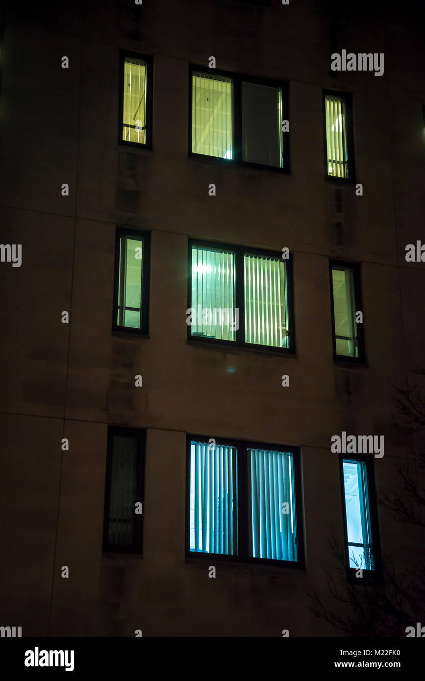 Anonymous building with lit windows at night, London Stock Photo - Alamy