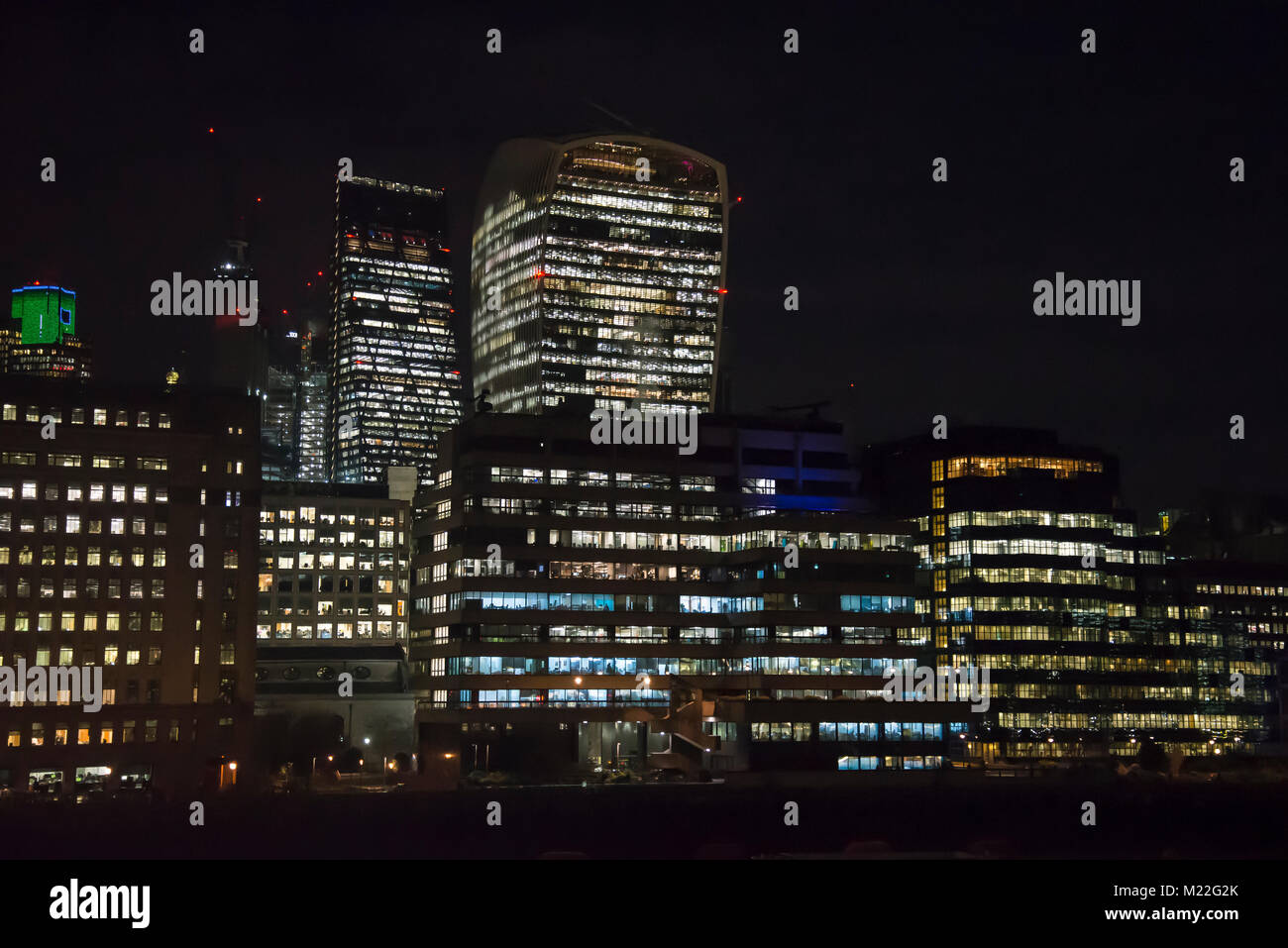 The City of London office buildings lit at night including the 20 ...