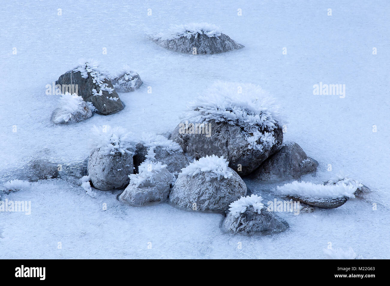 Frozen rocks on River in winter Stock Photo - Alamy