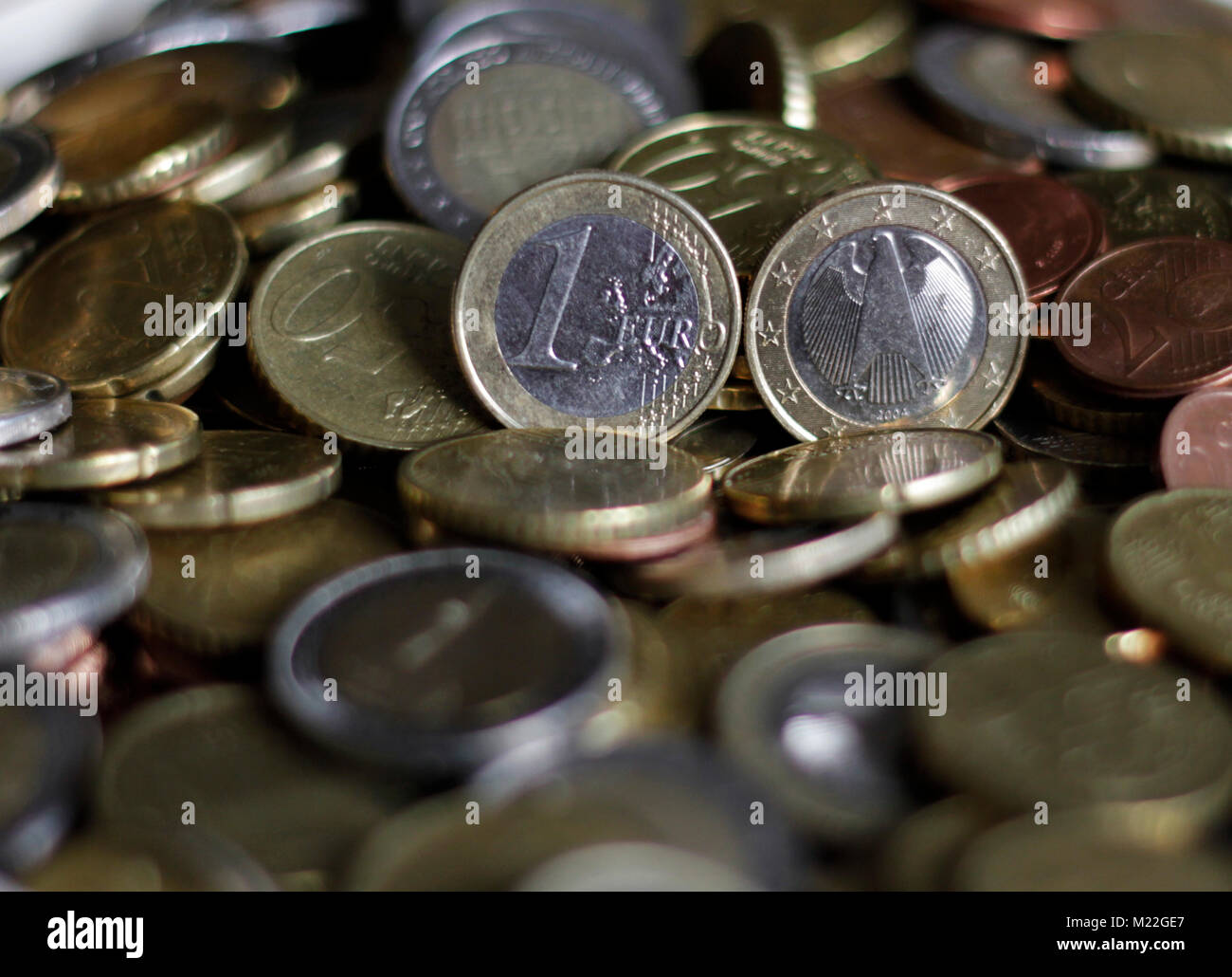 Two German Euro coins in the middle of a pile of coins Stock Photo - Alamy