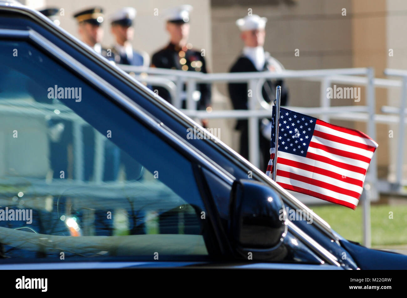 U.S. Flags adorn the presidential hearse at the state funeral service ...