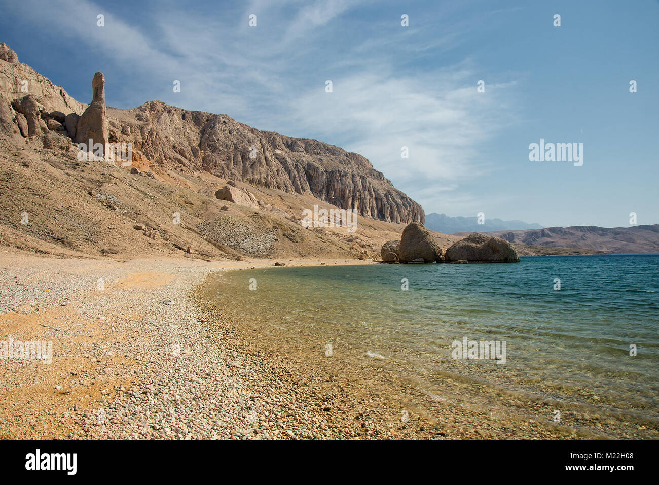 Beautiful sand beach with big rocks in the sea and turquoise blue water ...