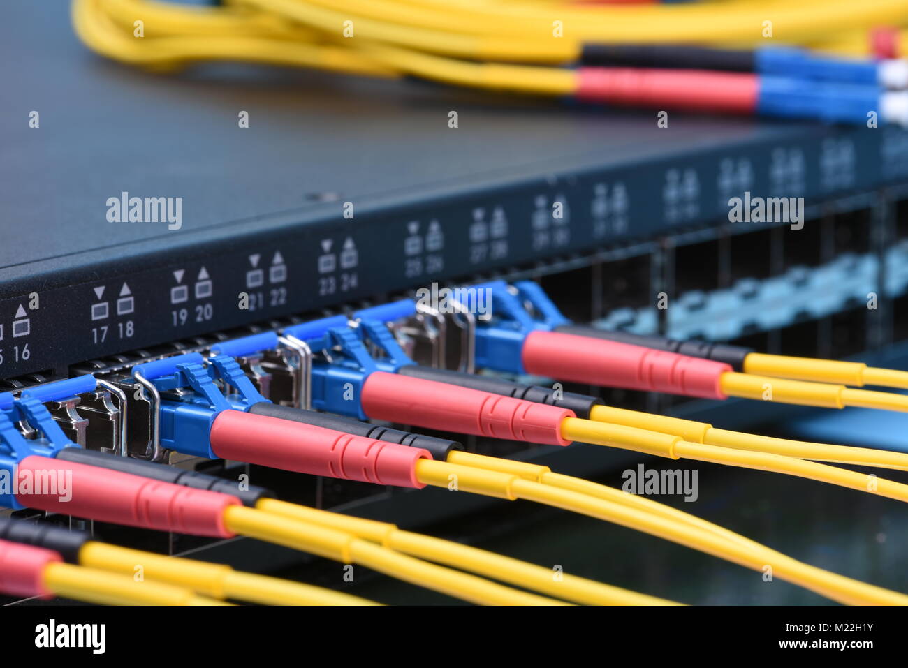 Switch with fiber optic cables in data center Stock Photo - Alamy
