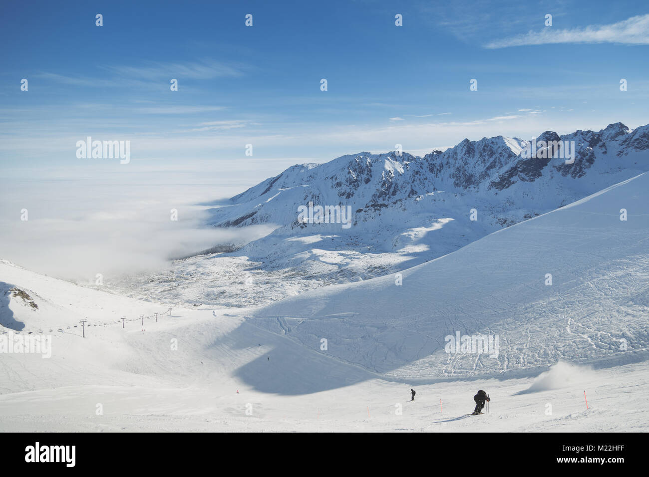 Skiing resorts. Snowy slopes in winter mountains Stock Photo - Alamy