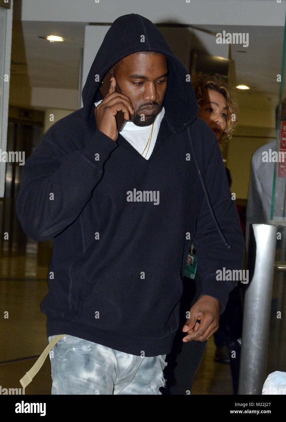 MIAMI, FL - APRIL 22: Kanye West arrives at Miami International Airport ...