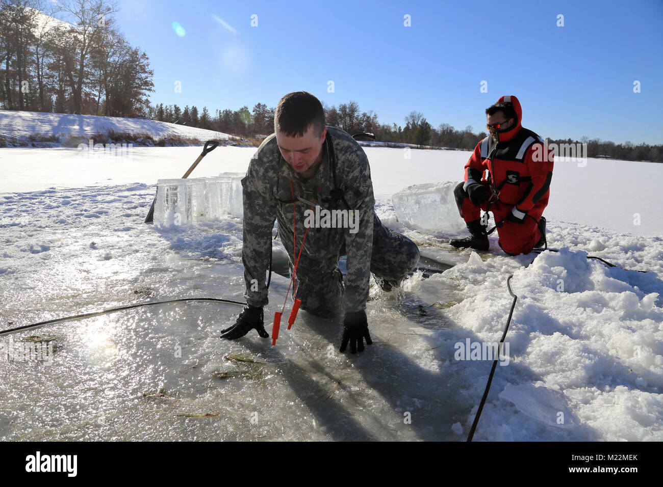 A Soldier participates in cold-water immersion training at an ice ...