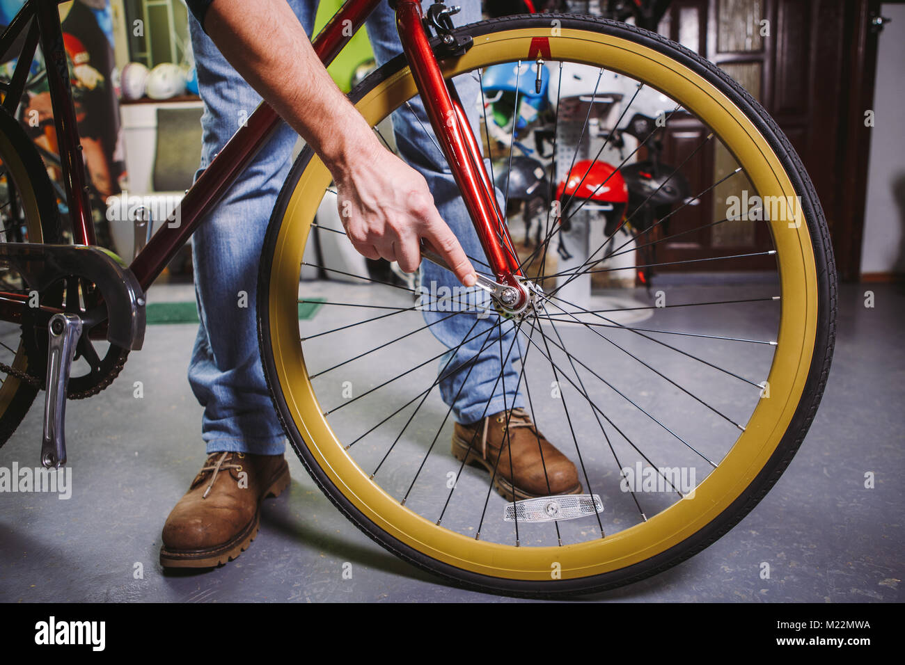 Theme repair bikes. Close-up of a Caucasian man's hand use a hand tool ...