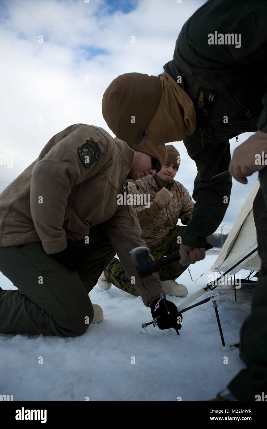 U.S. Marines with Marine Heavy Helicopter Squadron 464 set up a tent in ...