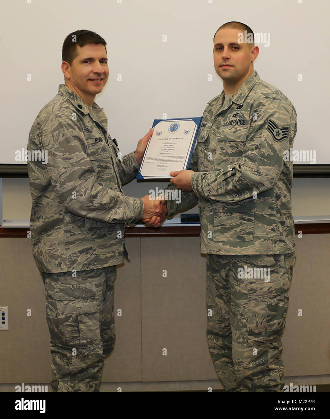 Tech. Sgt. Brady King, pictured on the right, was promoted on Wednesday ...