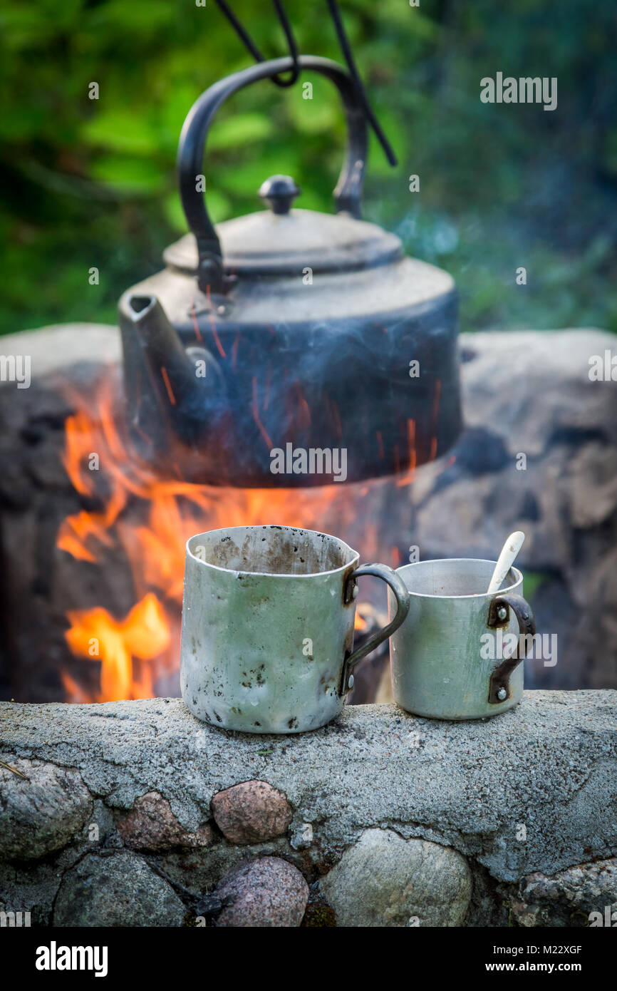 Aromatic and hot coffee with kettle on bonfire Stock Photo - Alamy