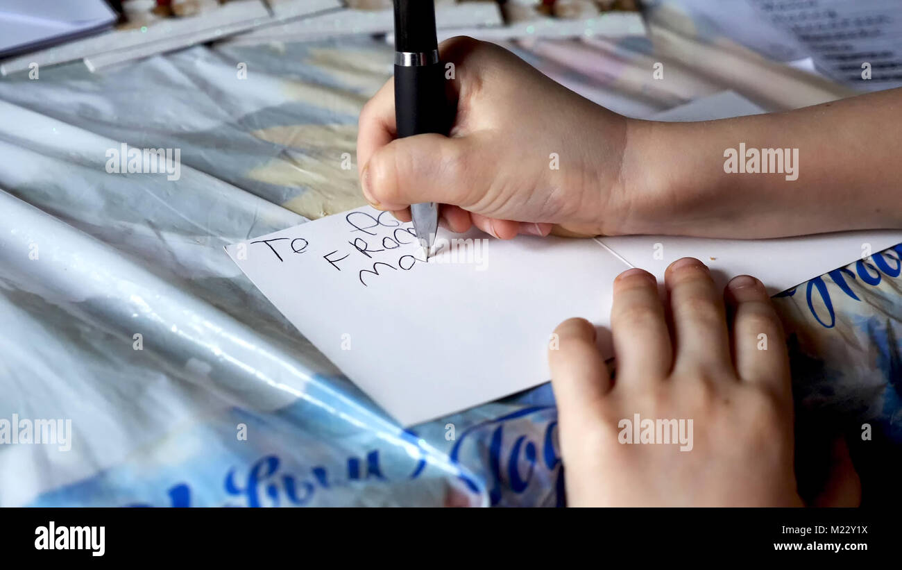 Boy writing with pen and ink hi-res stock photography and images - Alamy