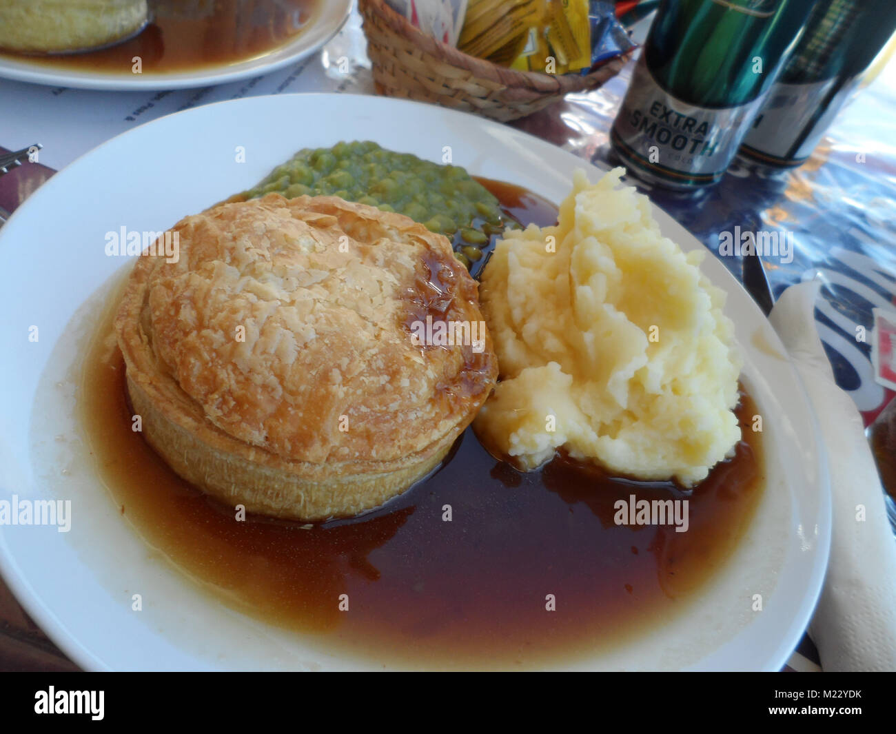 English Minced Beef pie with mashed potato, mushy peas and gravy Stock ...