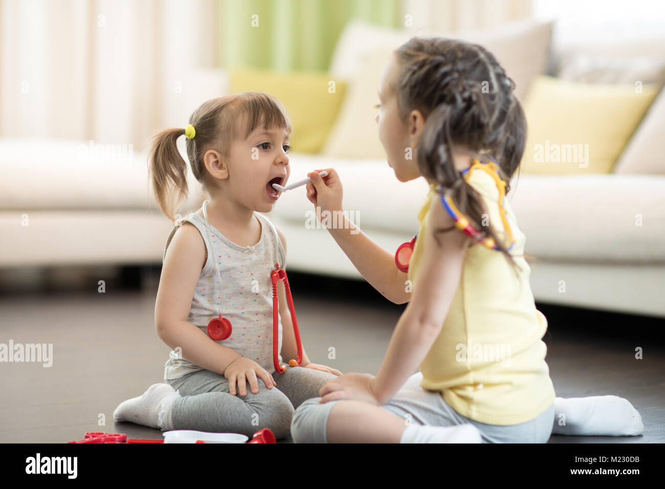 Two girls playing doctor nurse hi-res stock photography and images - Alamy