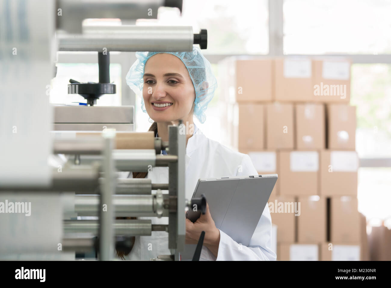 Manufacturing supervisor looking worried during quality control Stock ...