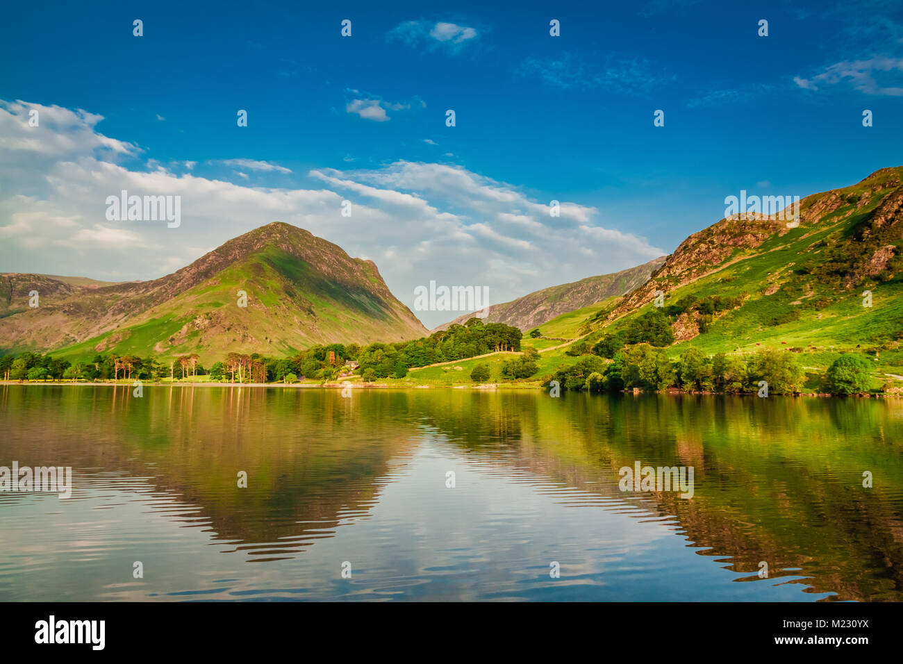 Stunning sunset at lake in District Lake, UK Stock Photo - Alamy