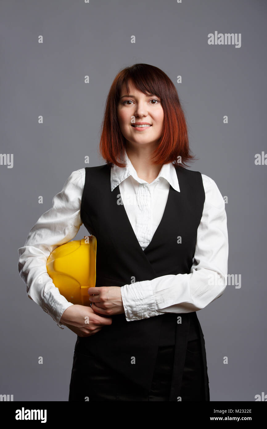 Woman in yellow helmet hi-res stock photography and images - Alamy