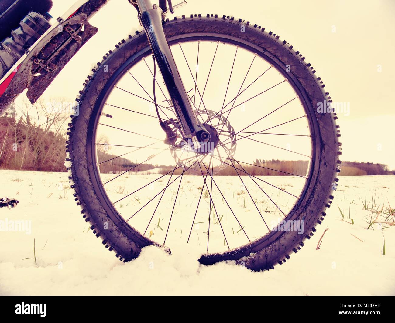 Winter snow riding on mountine bike. Extreme weather, slippery road in ...