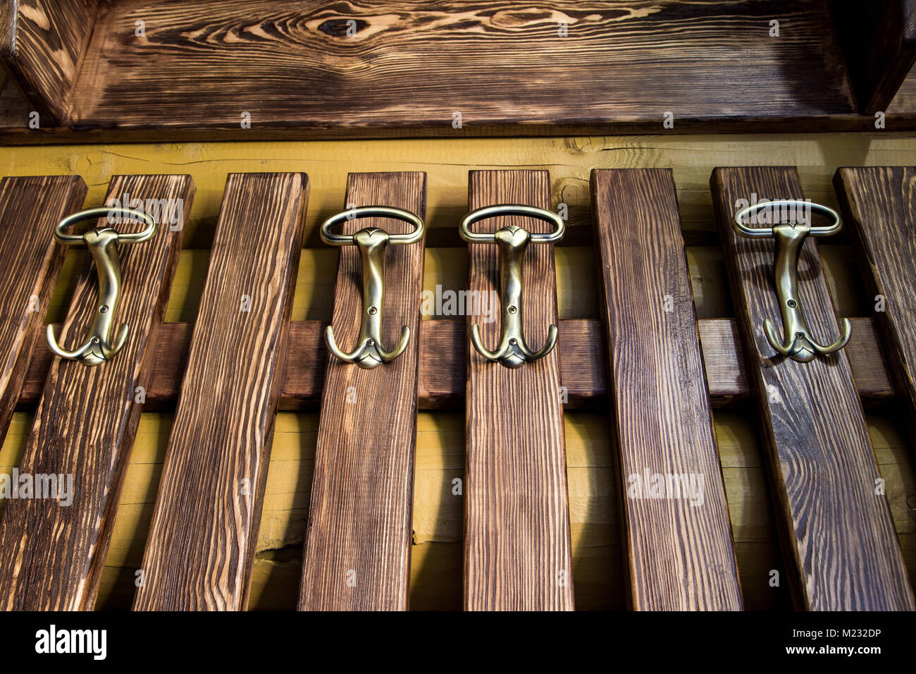 coat hooks on wooden planks Stock Photo - Alamy