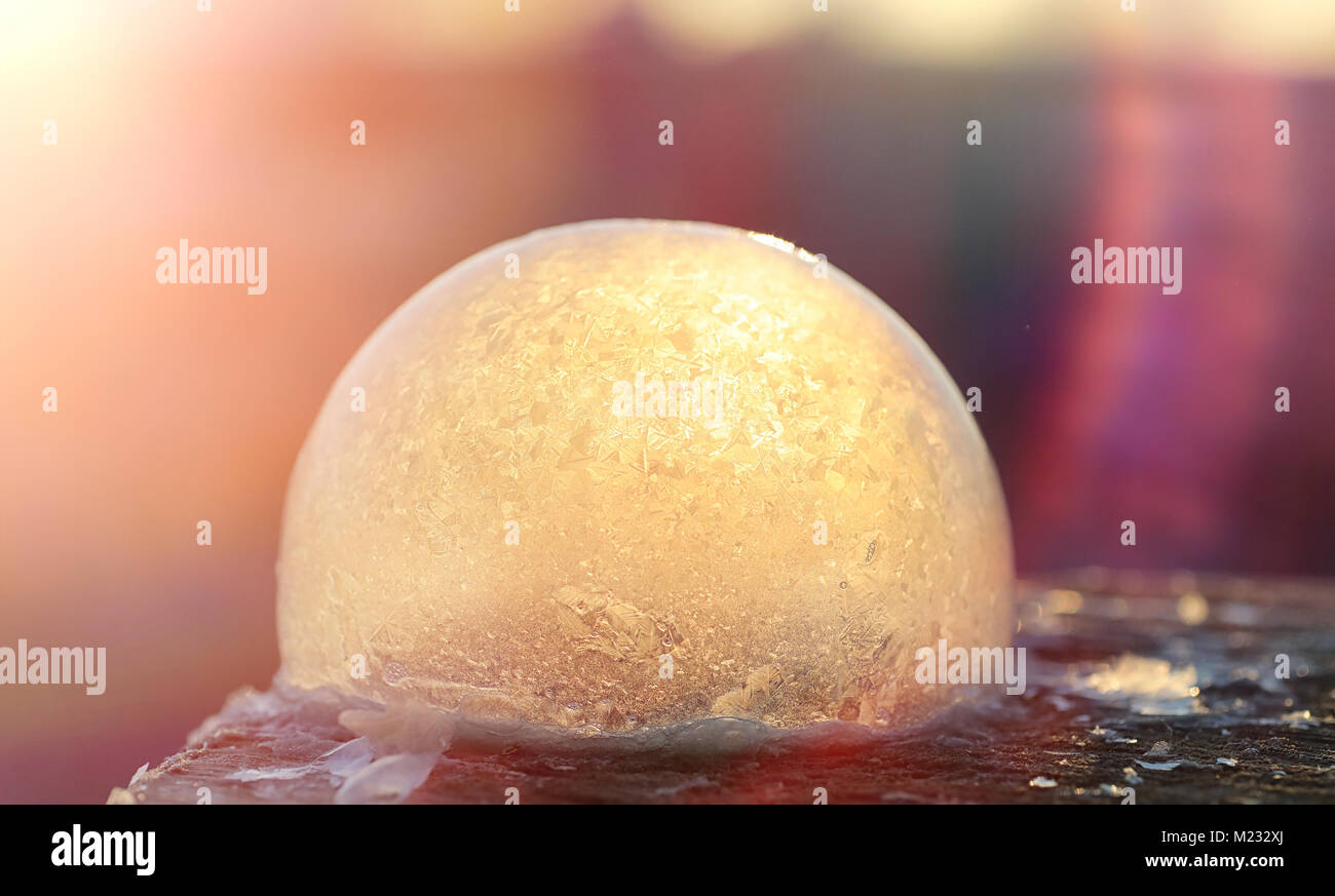 Soap bubbles freeze in the cold. Winter soapy water freezes in t Stock ...