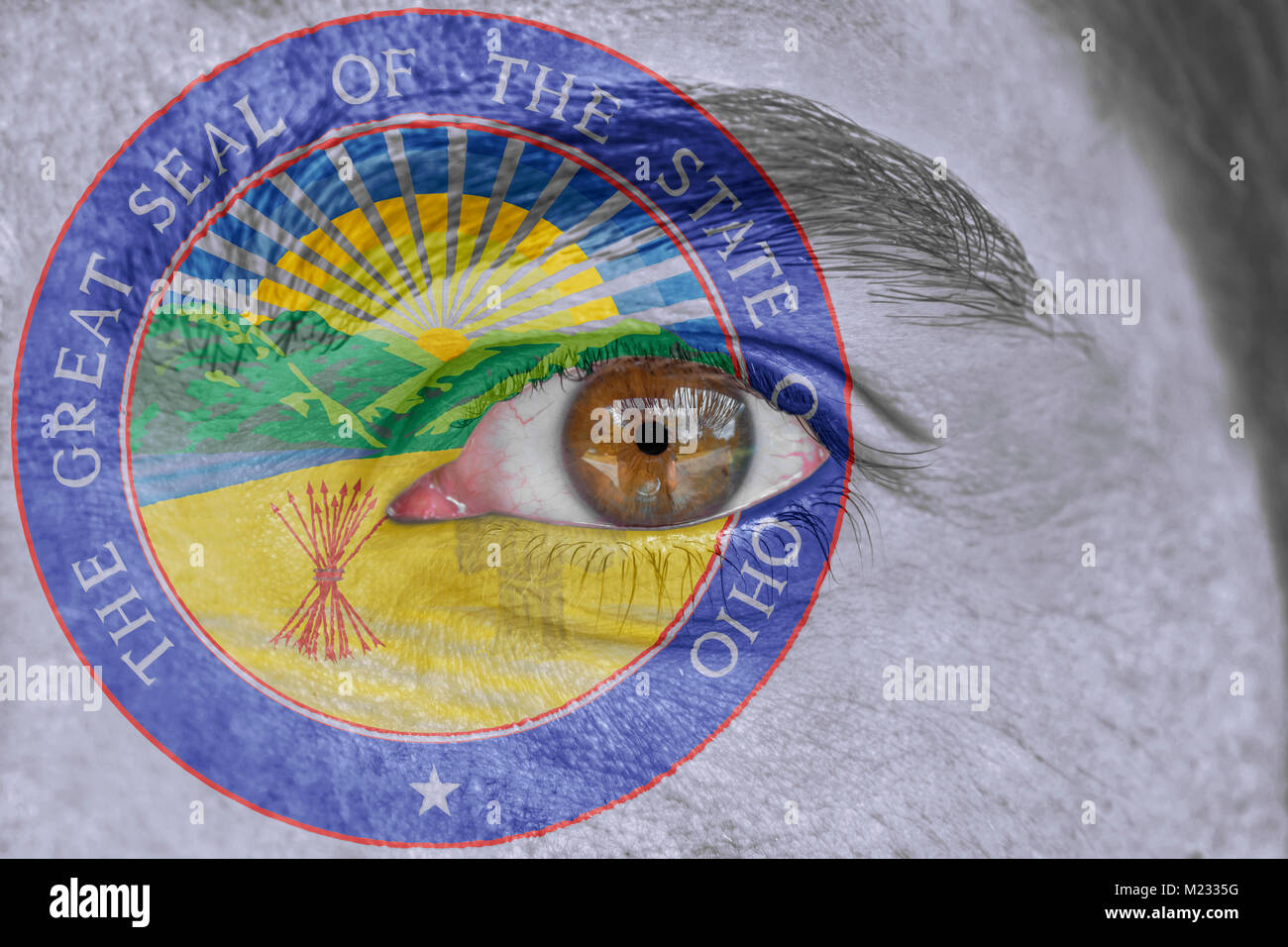 Human face and eye painted with US state seal flag of Ohio Stock Photo ...