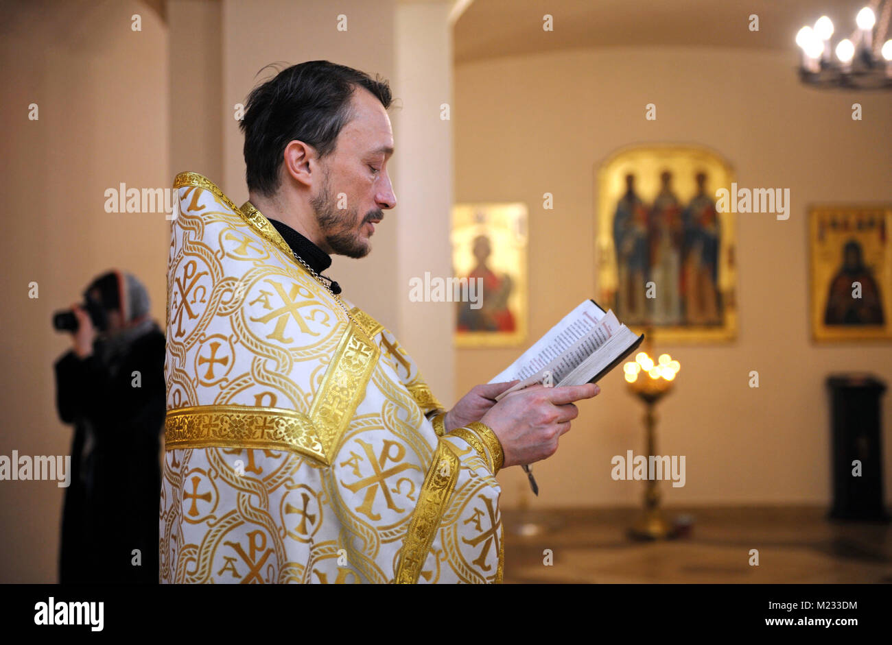 Priest reading bible hi-res stock photography and images - Alamy