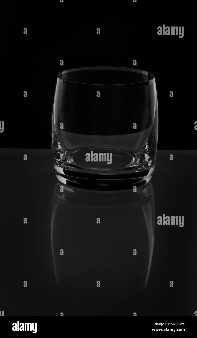 One empty glass on black background with reflection Stock Photo - Alamy