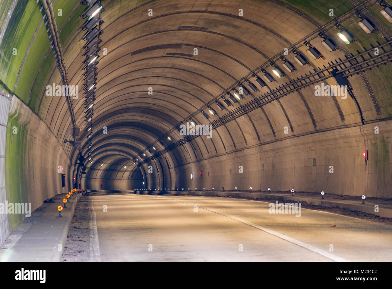 Tunnel Road with two lane highway Stock Photo - Alamy