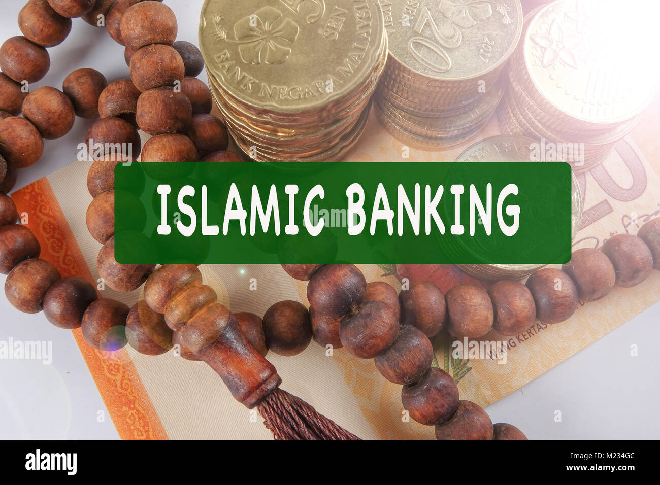 Rosary and coins. Islamic Banking/Finance concept Stock Photo - Alamy