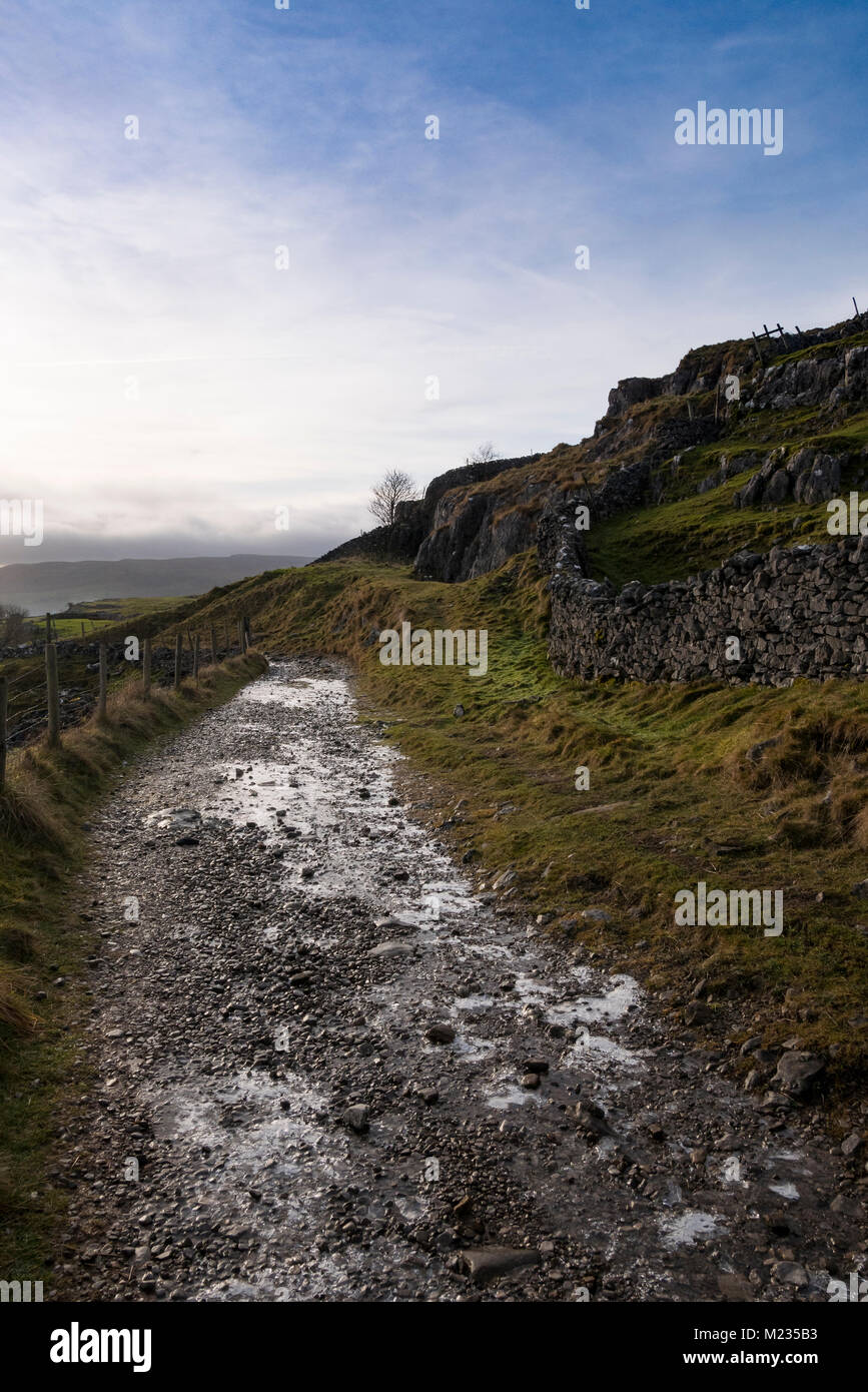 An icy path along the Pennine Way route during winter in the Yorkshire ...