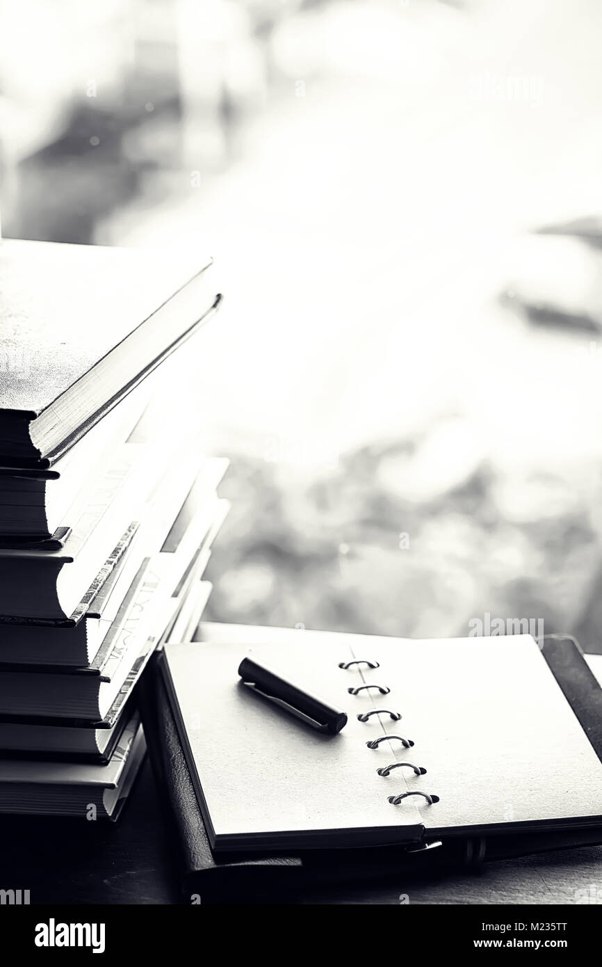 A stack of textbooks on a table Stock Photo - Alamy