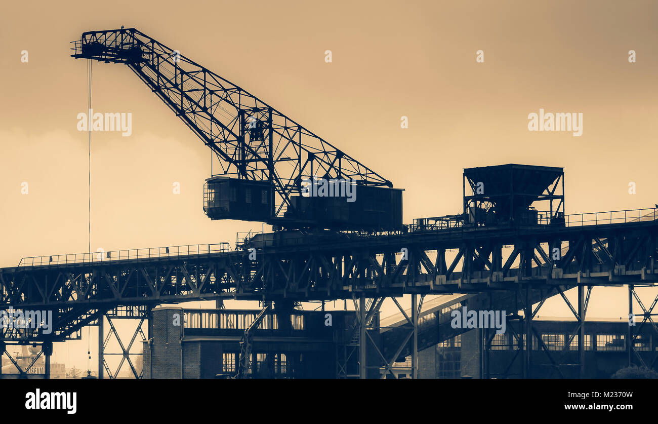 Cranes, old shipyard buildings, rusty structures. Factory building ...