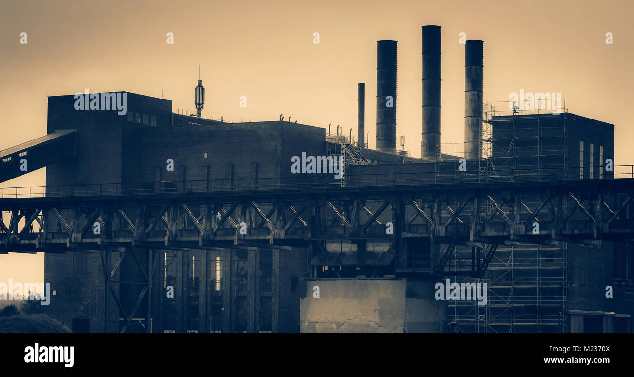 Cranes, old shipyard buildings, rusty structures. Factory building ...