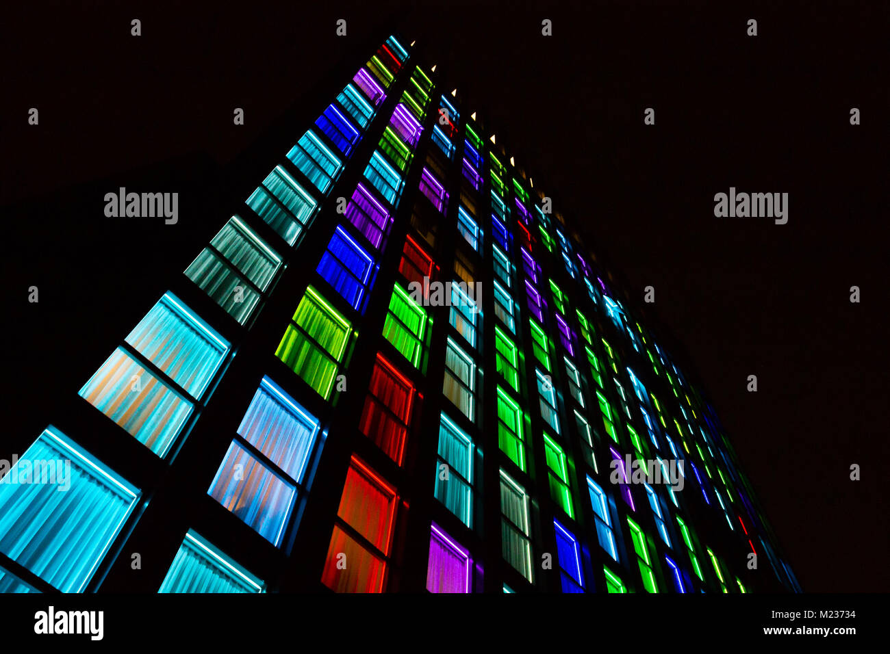 Colored windows texture. Windows illuminated by neon lights background ...