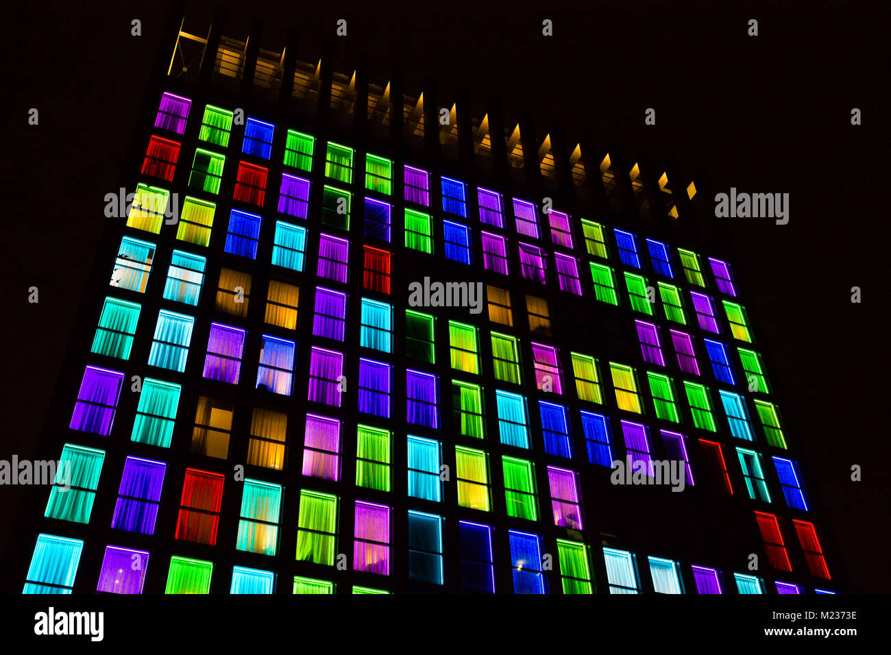 Colored windows texture. Windows illuminated by neon lights background ...